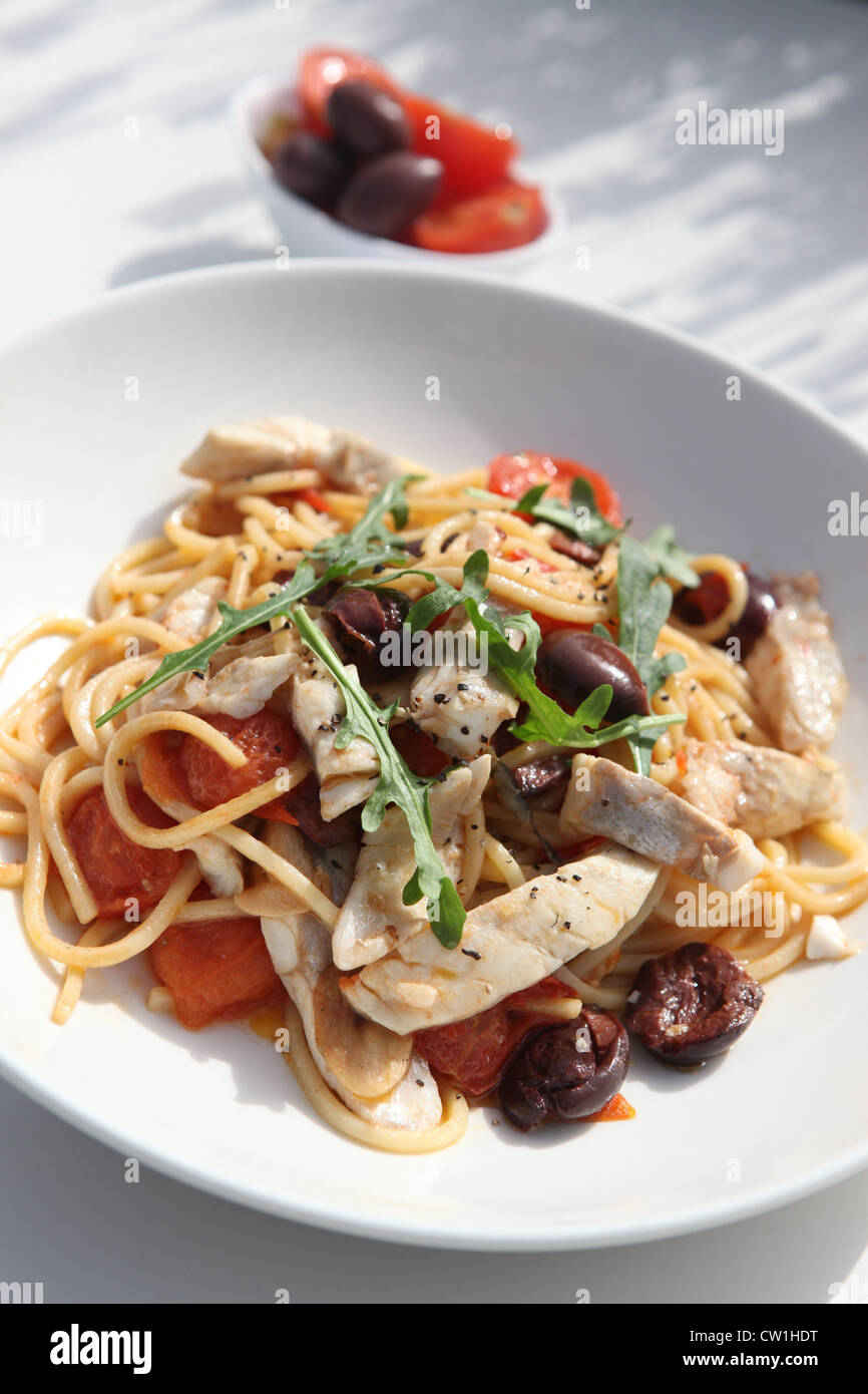 Spaghetti with fish and olives Stock Photo - Alamy