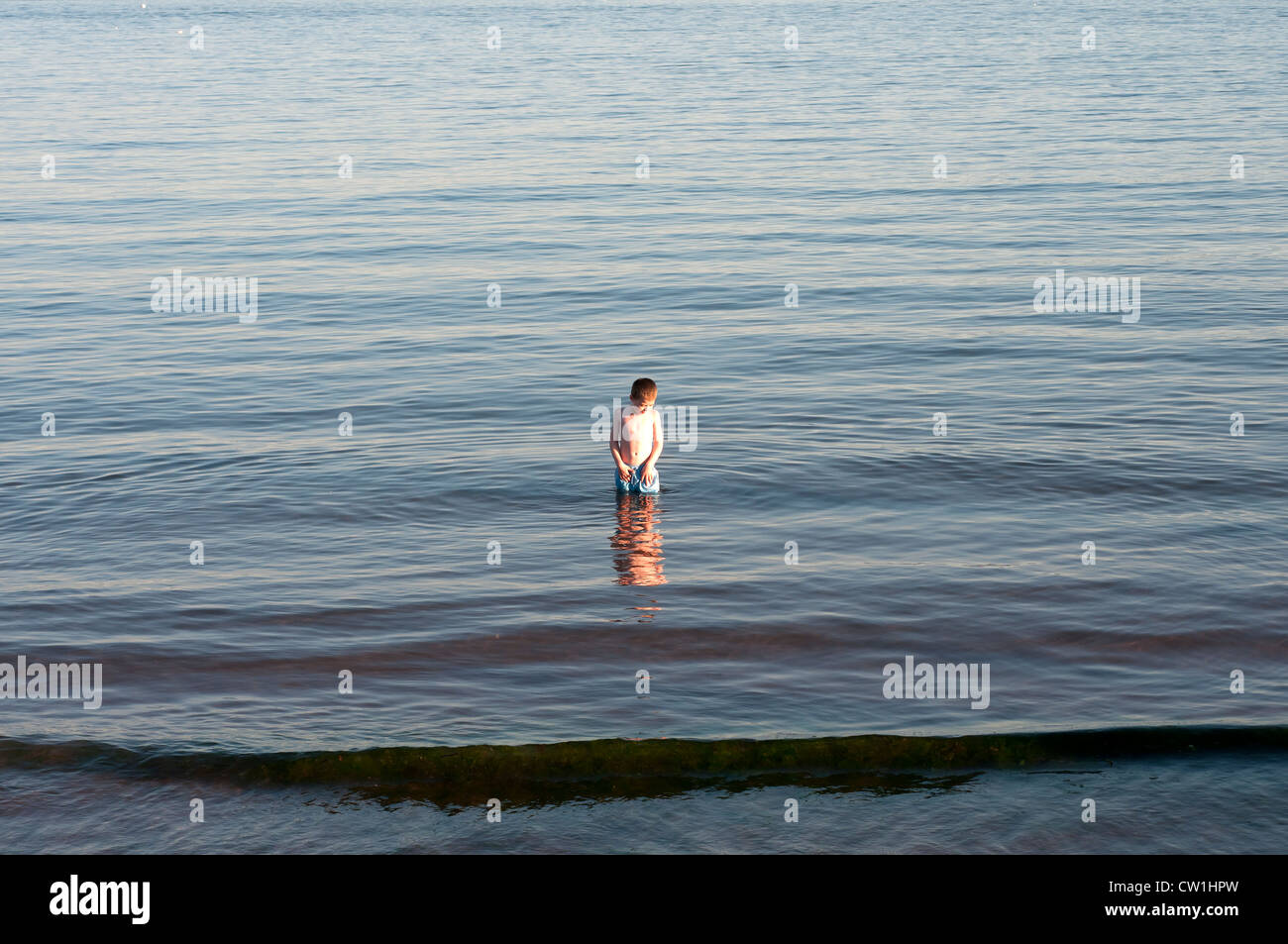 child wading in the sea Stock Photo - Alamy