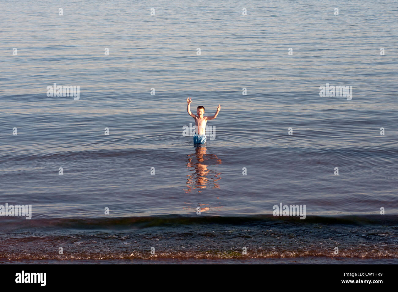 child wading in the sea Stock Photo - Alamy