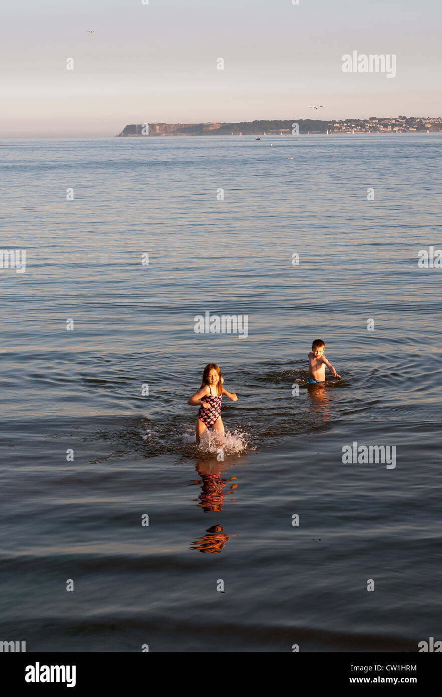 children wading into the sea Stock Photo - Alamy