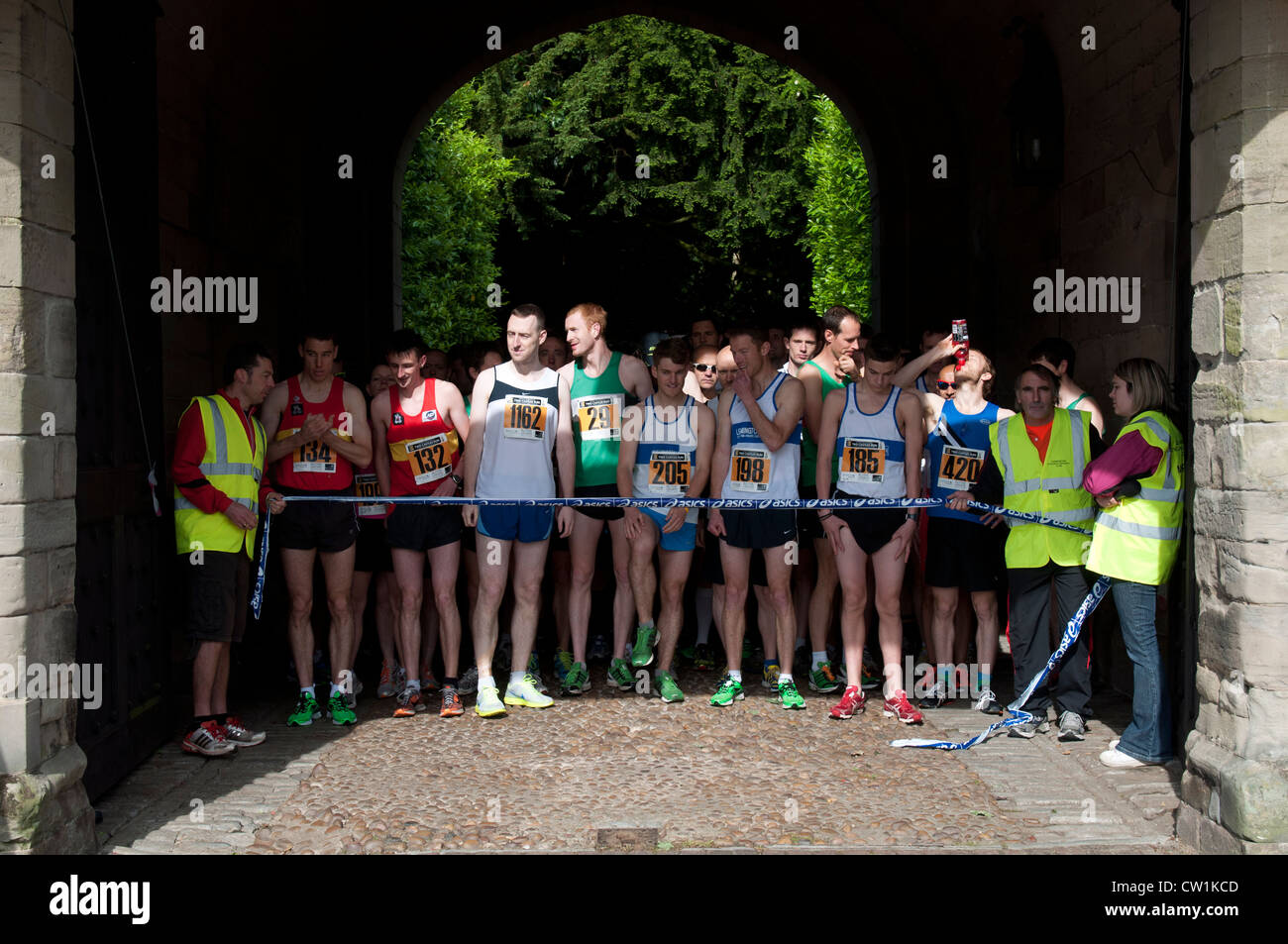 Runners waiting at start line of a 10k race Stock Photo - Alamy