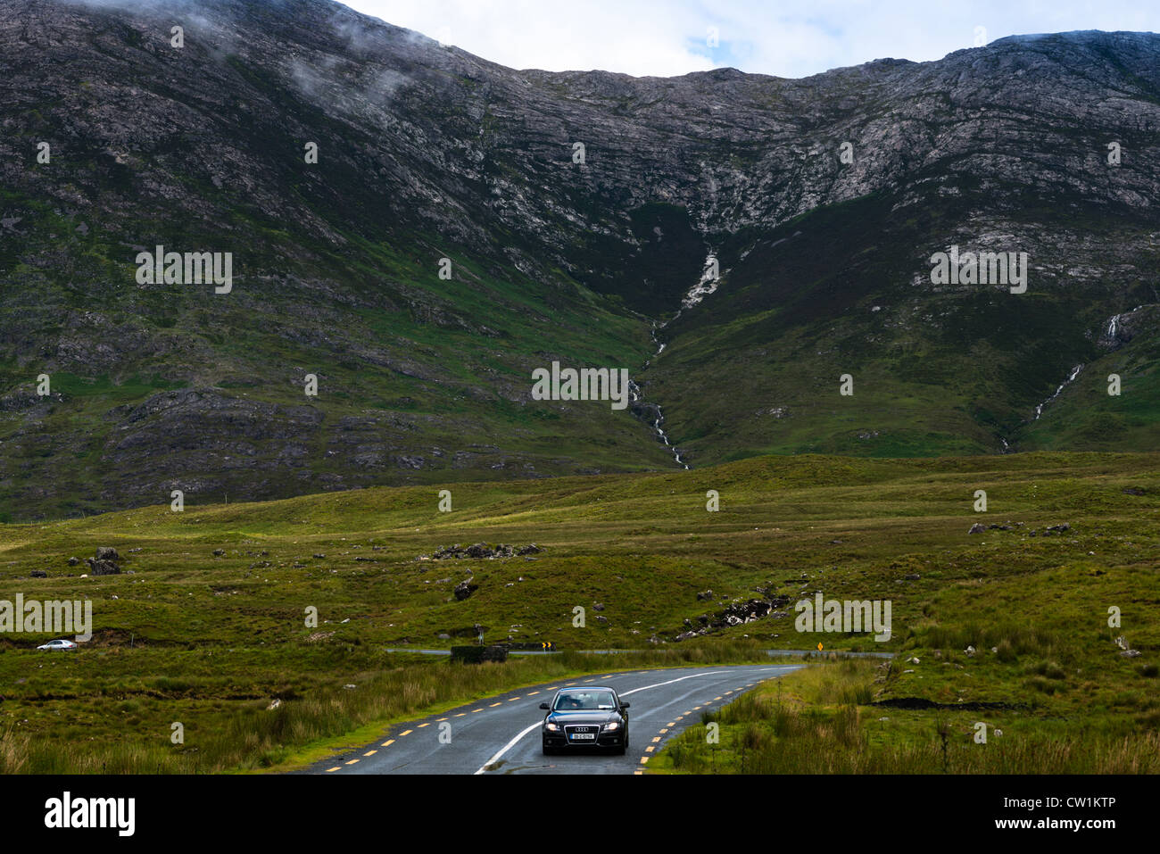 The R344 road running through the Connemara mountains in county Galway ...