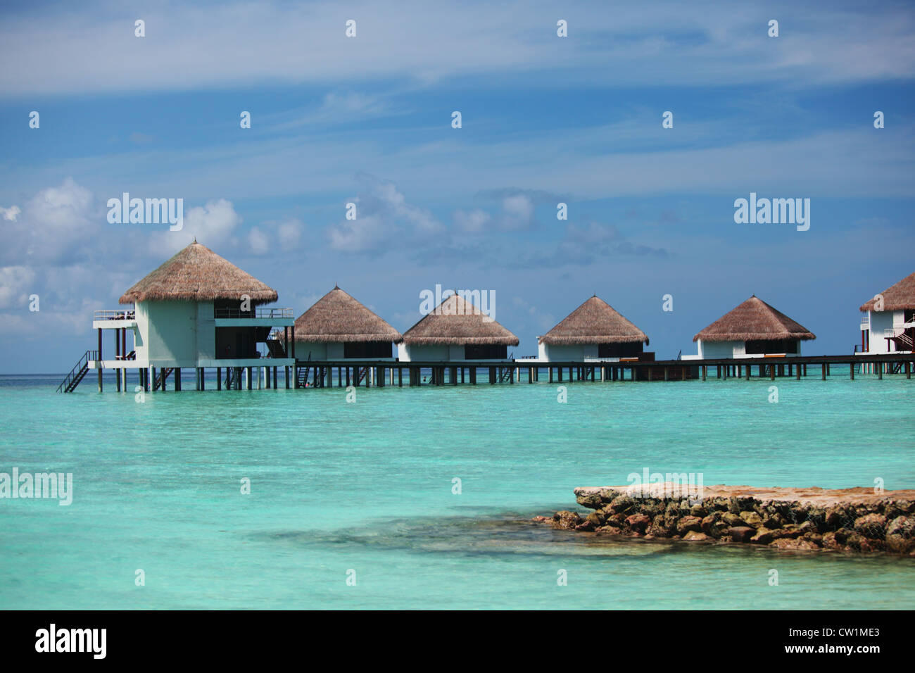 resort maldivian houses in blue sea Stock Photo - Alamy