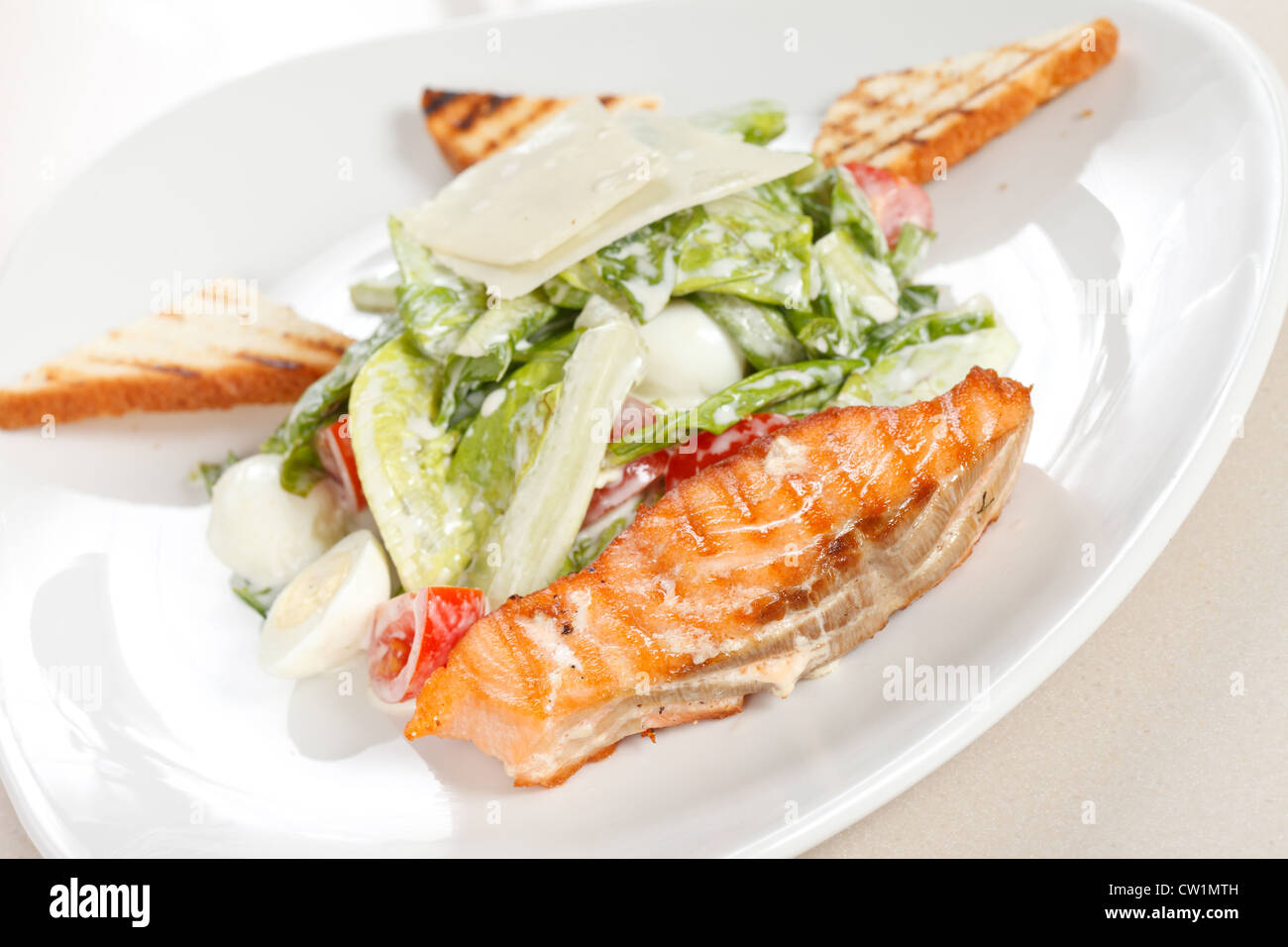 Fish steak with vegetables Stock Photo - Alamy