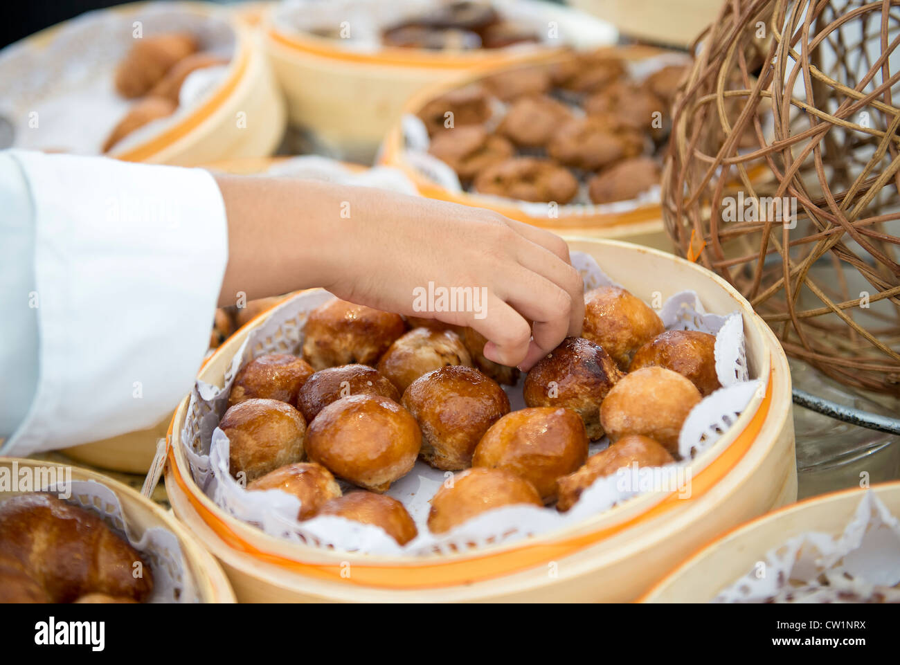 Hands taking bread from a breakfast buffet Stock Photo - Alamy
