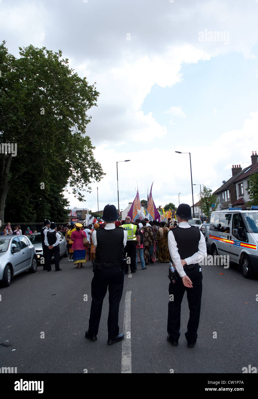 police officer bring up the rear of the 2012 newham carnival procession ...
