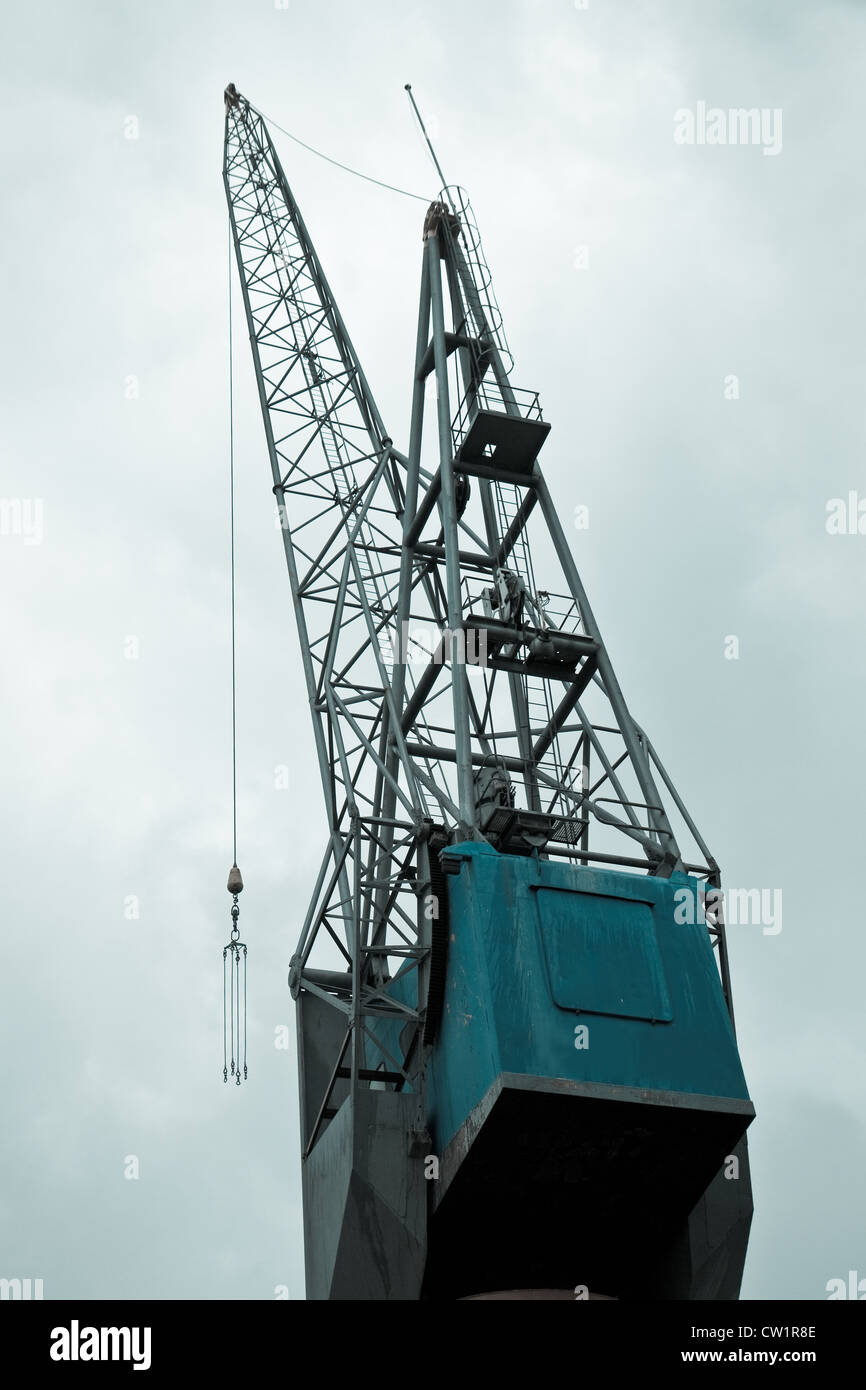 Big crane on quay in port with cloudy sky background Stock Photo - Alamy