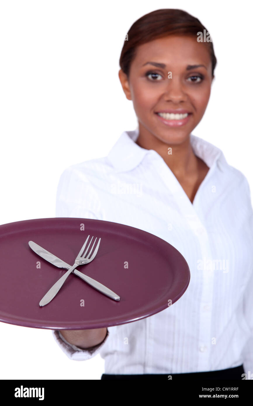 waitress holding a plate with knife and fork Stock Photo - Alamy