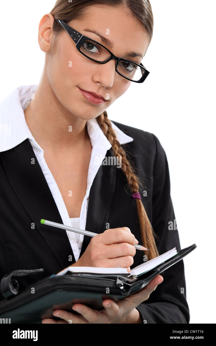 businesswoman taking notes Stock Photo - Alamy
