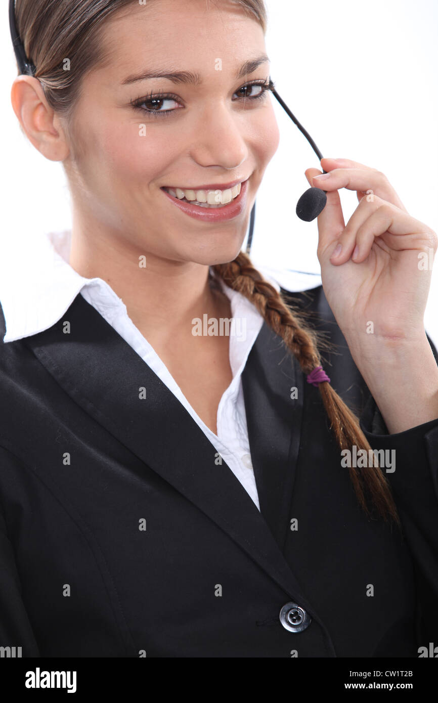 Smiling female telemarketer Stock Photo - Alamy