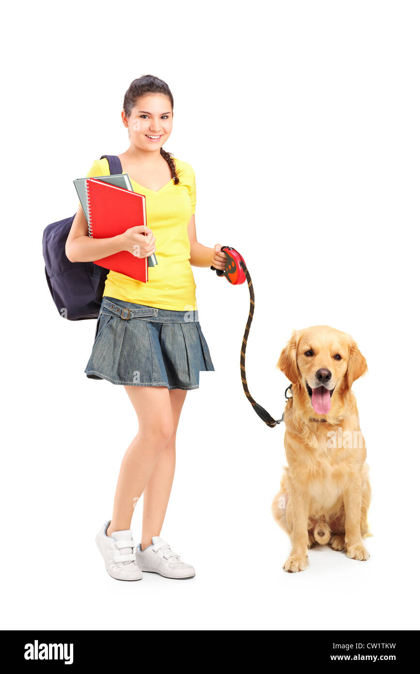 Full length portrait of a female student with dog isolated on white ...