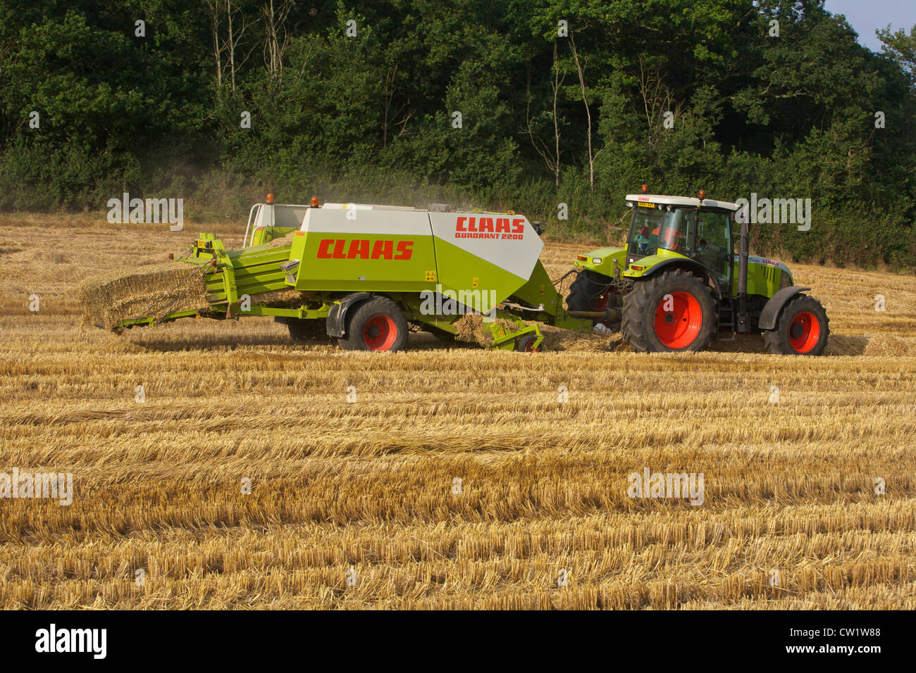 Claas Ares 697 ATZ baling Straw UK Stock Photo - Alamy