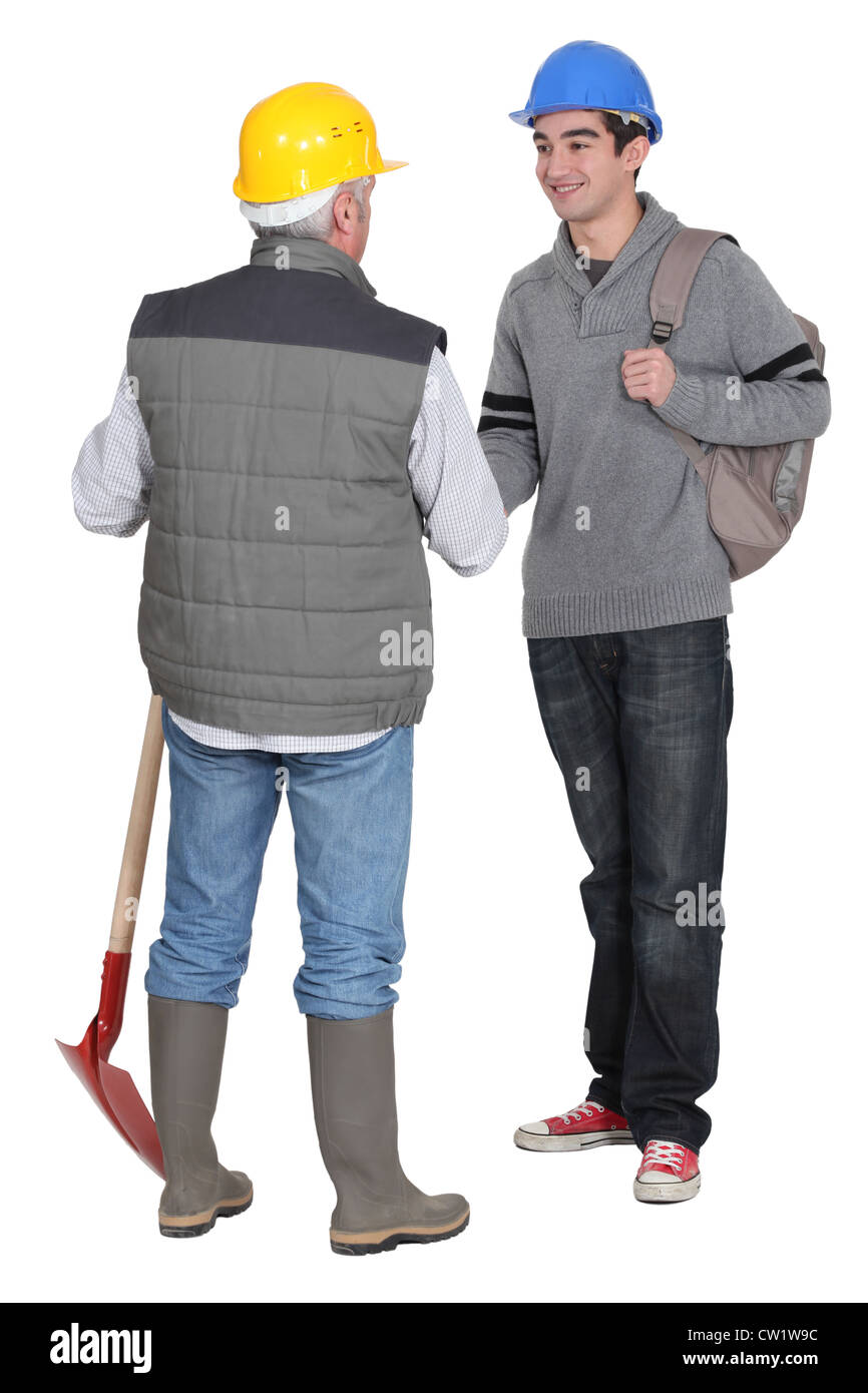 Experienced tradesman meeting his new apprentice for the first time ...