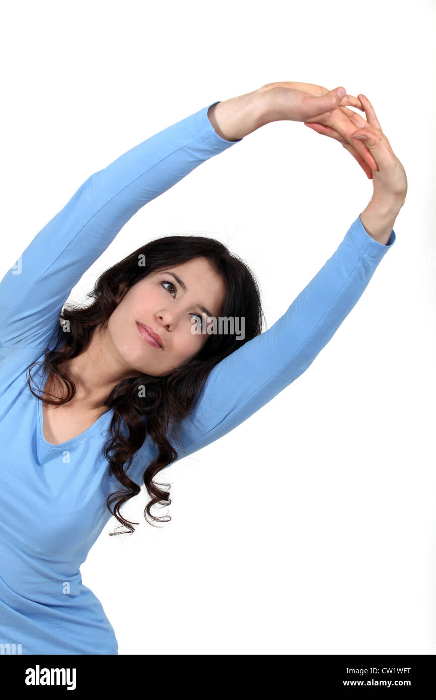 Female model stretching Stock Photo - Alamy