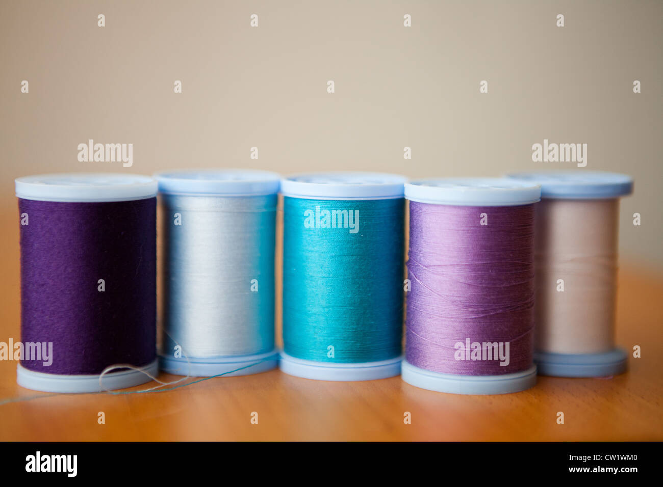 Colorful spools of sewing thread Stock Photo - Alamy