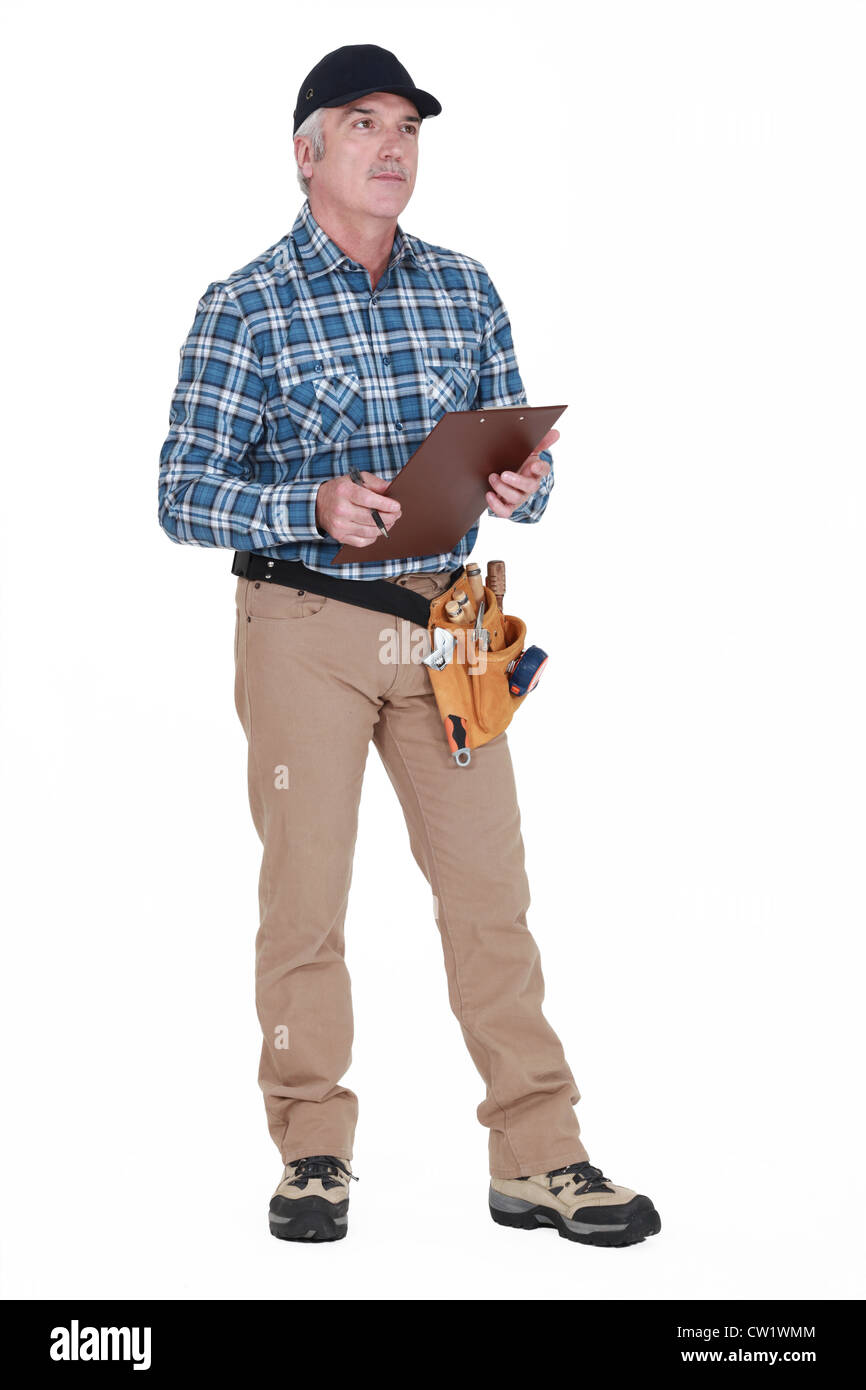 Carpenter with a clipboard Stock Photo - Alamy