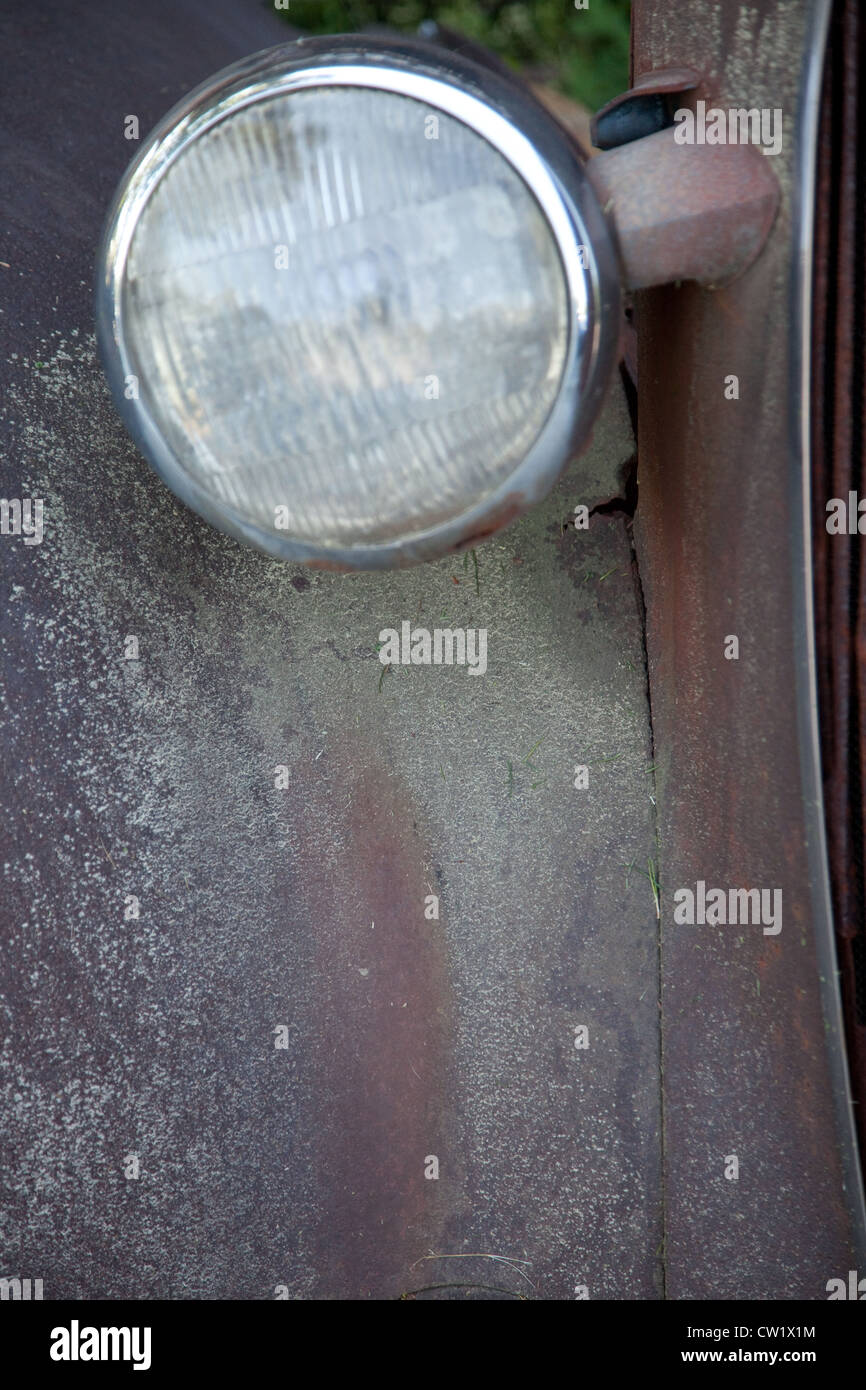 Old, rusty car headlight and fender, outside, outdoors environment rust ...