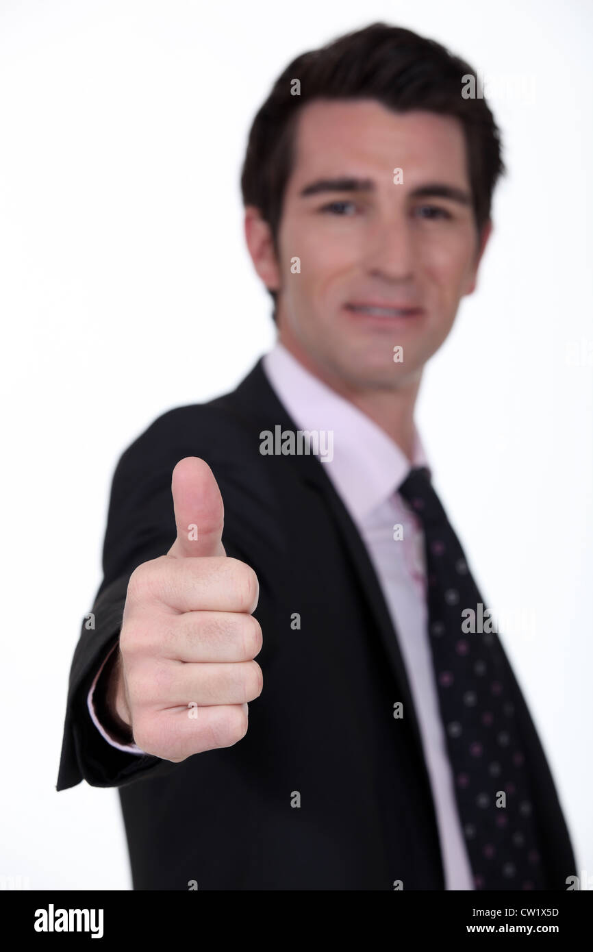 Businessman giving the thumb's up Stock Photo - Alamy