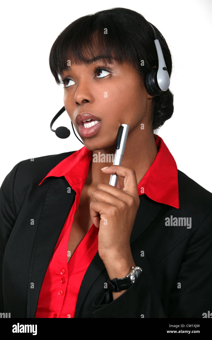 Woman daydreaming at work Stock Photo - Alamy