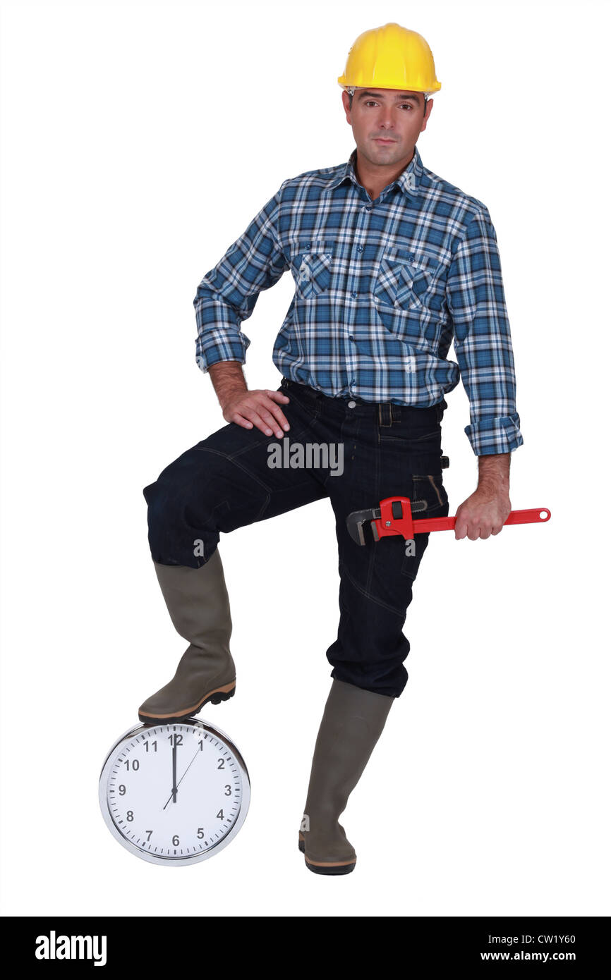 Construction worker with a clock Stock Photo - Alamy