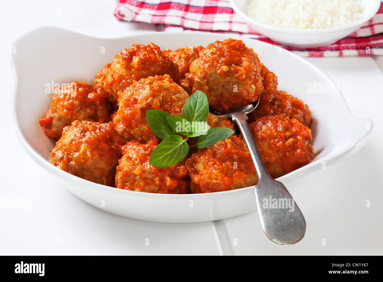Turkey meatballs in tomato sauce with a spoon Stock Photo - Alamy
