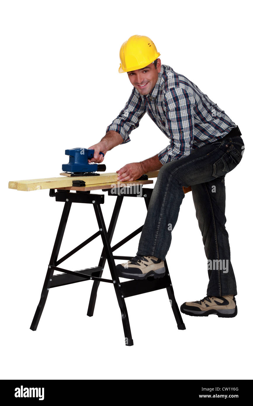 Carpenter using electric sander Stock Photo - Alamy