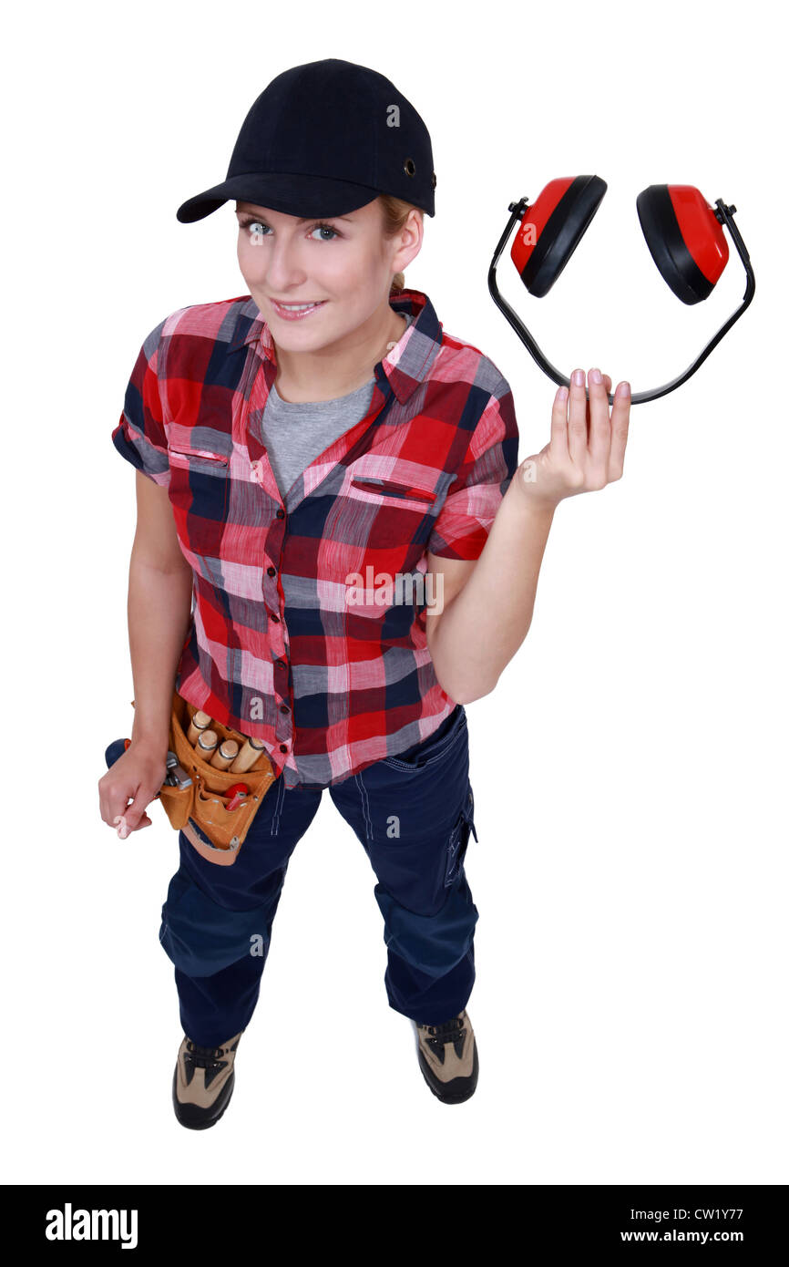 Female carpenter holding hearing protection Stock Photo - Alamy