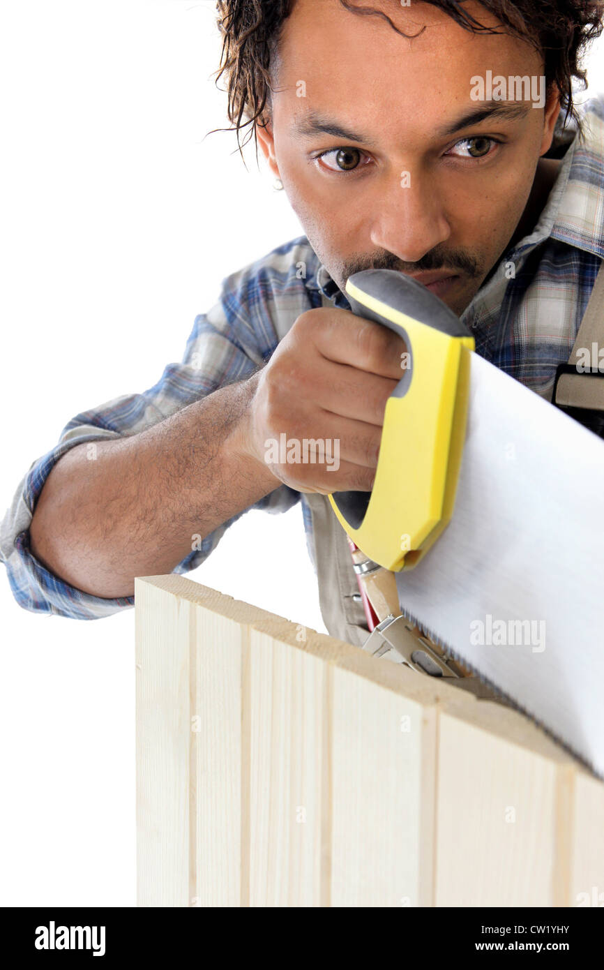 Man sawing wood Stock Photo - Alamy