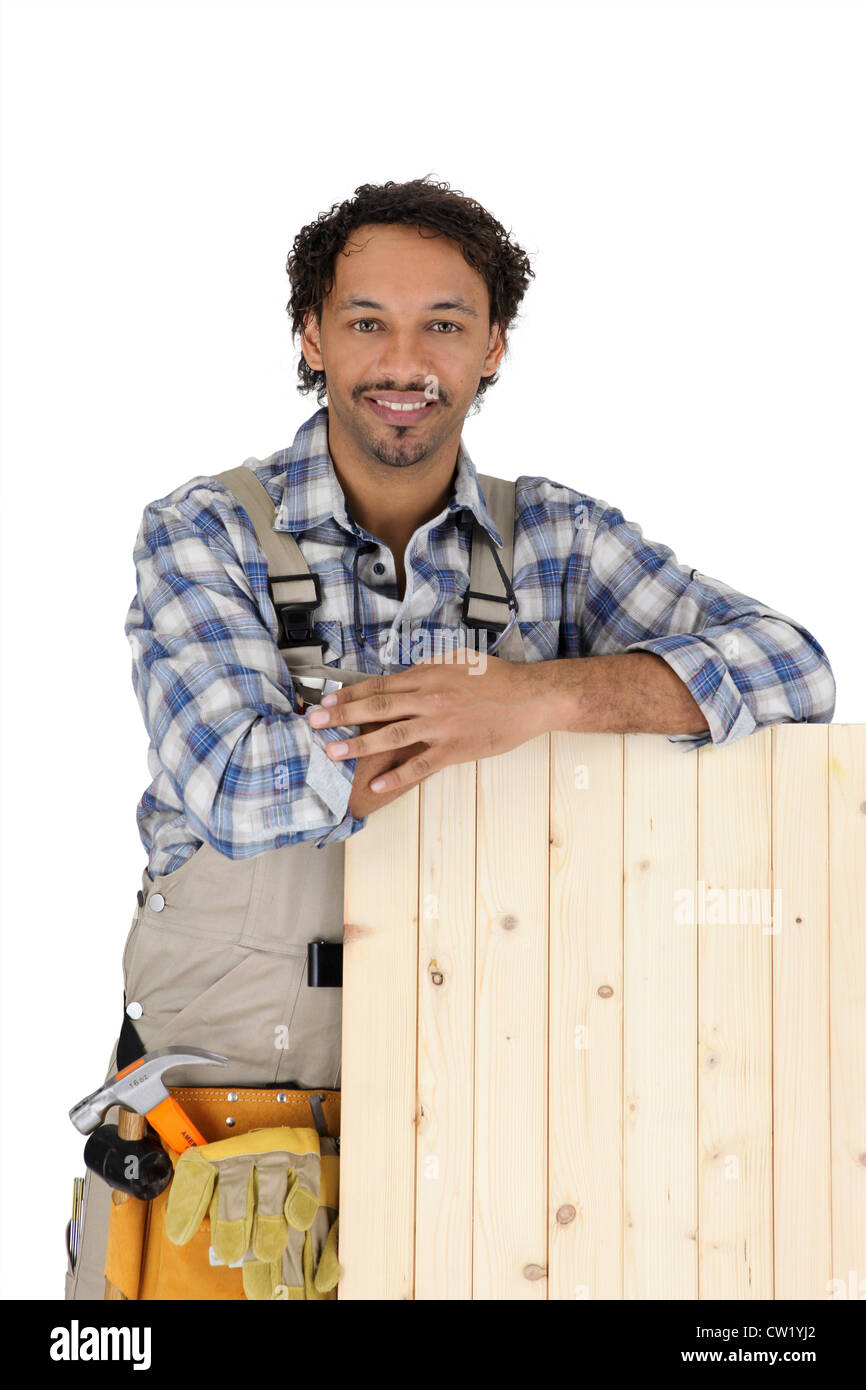 Carpenter with a wooden shutter Stock Photo - Alamy