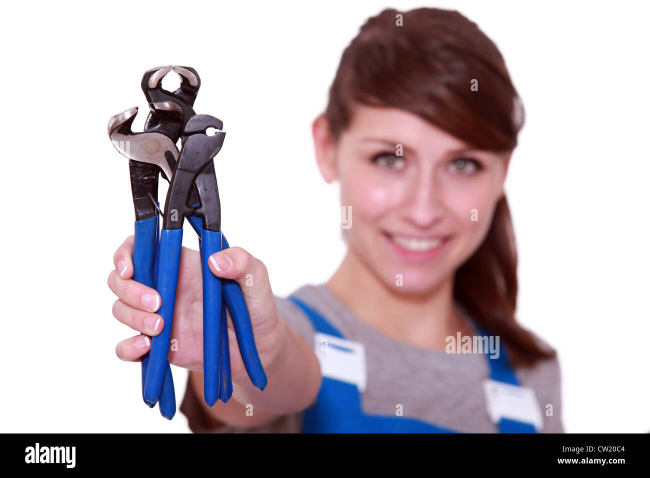 Woman with pliers Stock Photo - Alamy