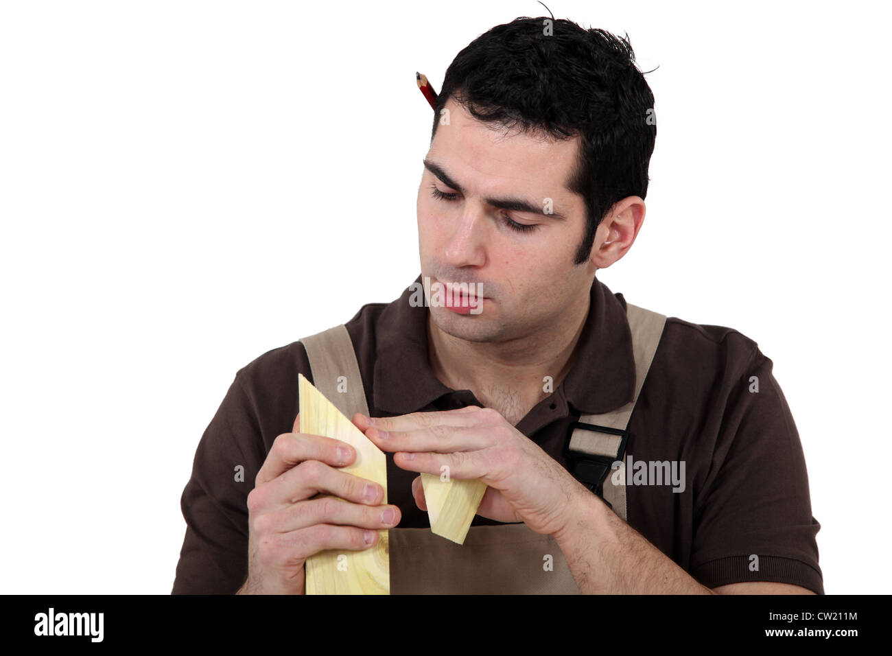 Carpenter checking wood joint Stock Photo - Alamy