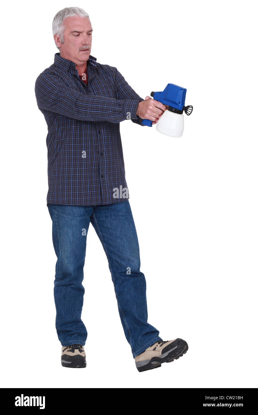 Worker hand holding spray Cut Out Stock Images & Pictures - Alamy