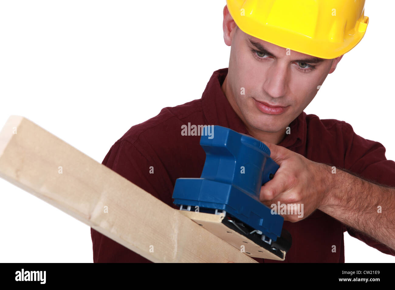 Worker with an electric sander Stock Photo - Alamy