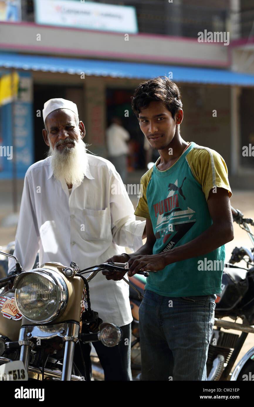 Young Muslim mechanic with elderly Muslim man Andhra Pradesh South ...