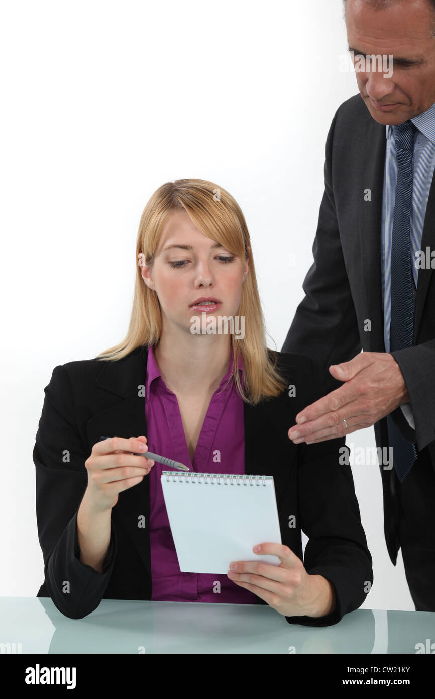 Woman explaining point to boss Stock Photo - Alamy