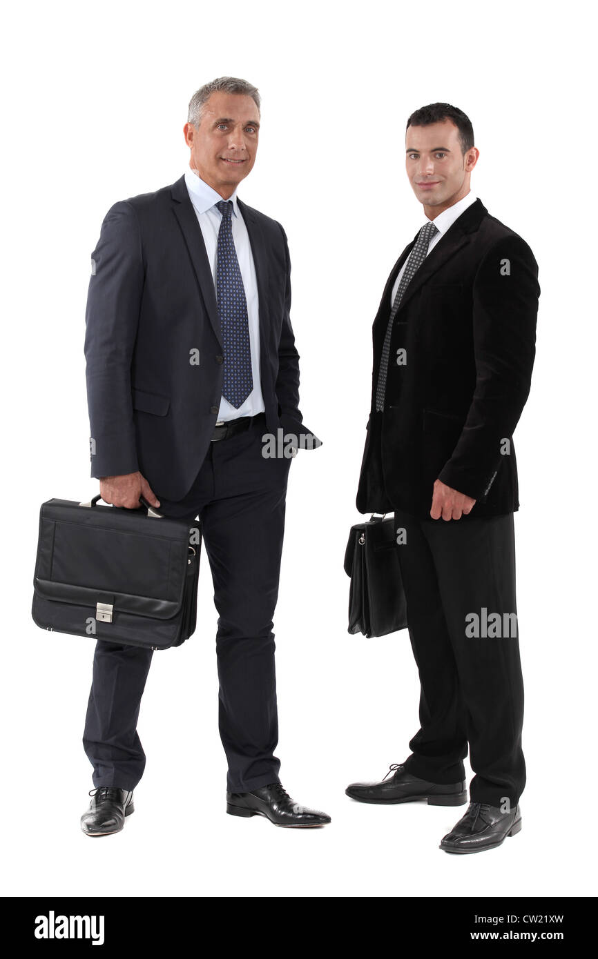 Two businessmen with briefcase Stock Photo - Alamy