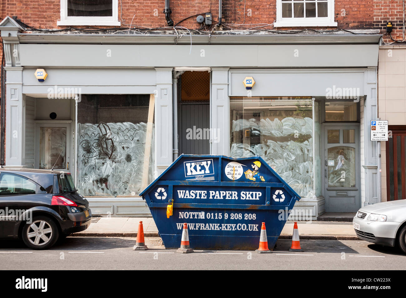 A Frank Key Group waste paper skip stands outside an empty business ...