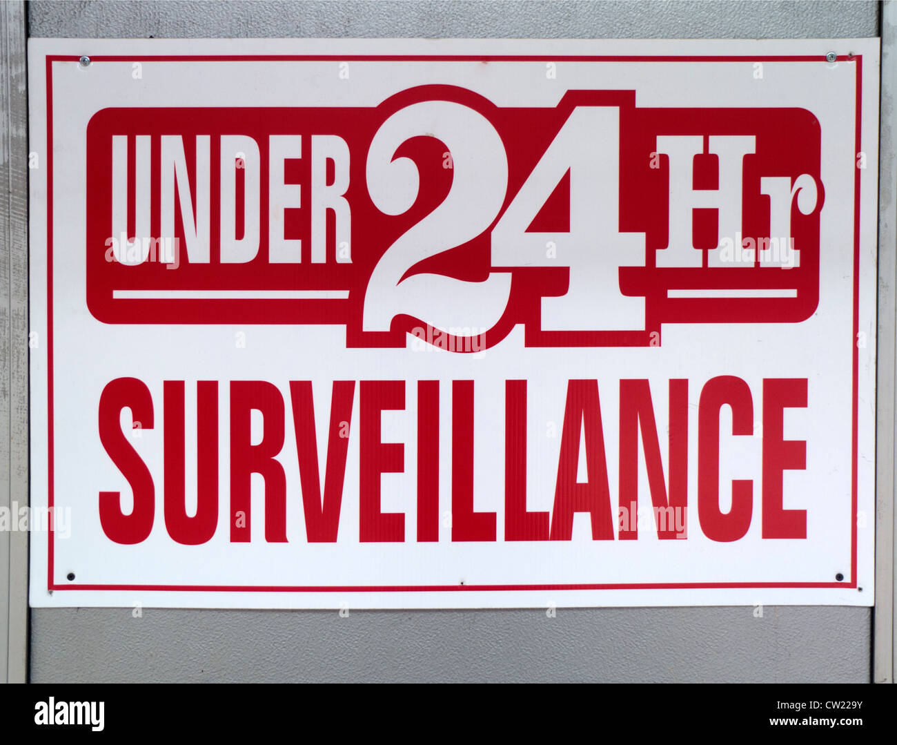 under 24 hour surveillance sign Stock Photo - Alamy