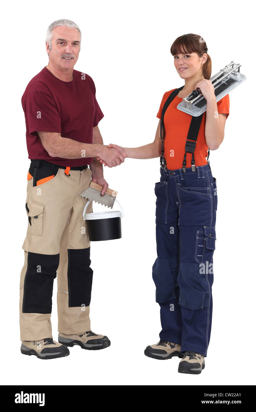 Tradespeople forming a partnership Stock Photo - Alamy