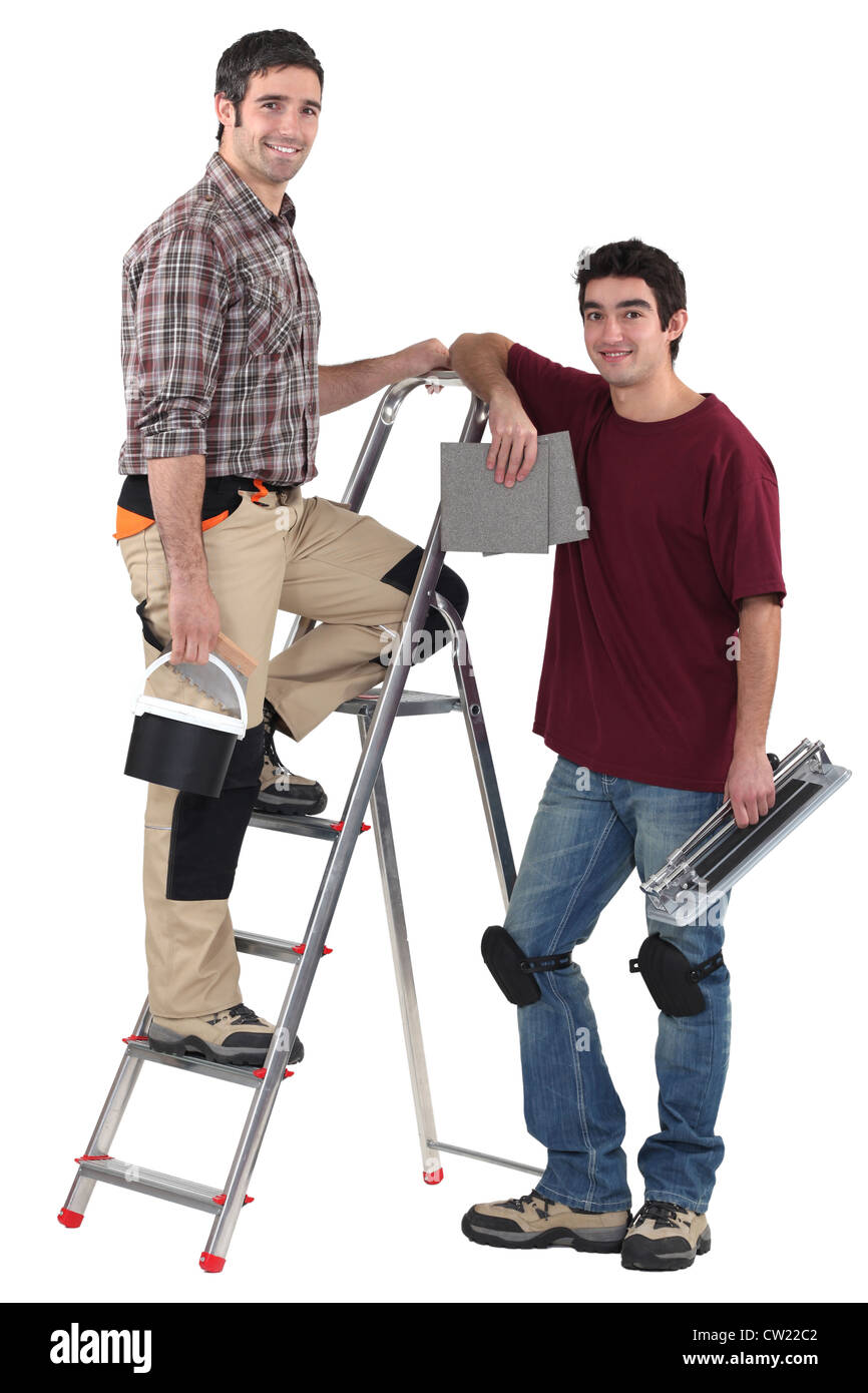 Tiler and apprentice on white background Stock Photo - Alamy
