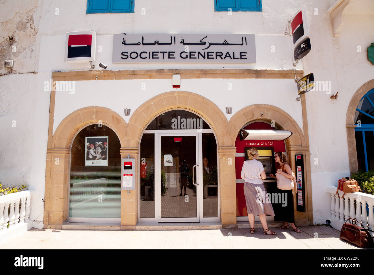 People taking cash at an ATM Societe Generale bank, Essaouira Morocco ...