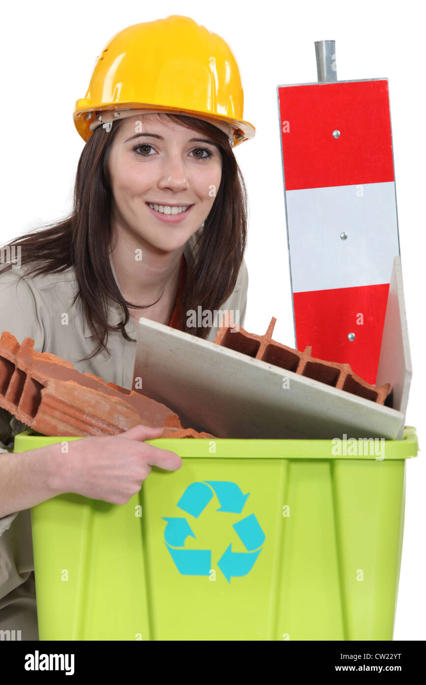 A female construction worker recycling scraps Stock Photo - Alamy