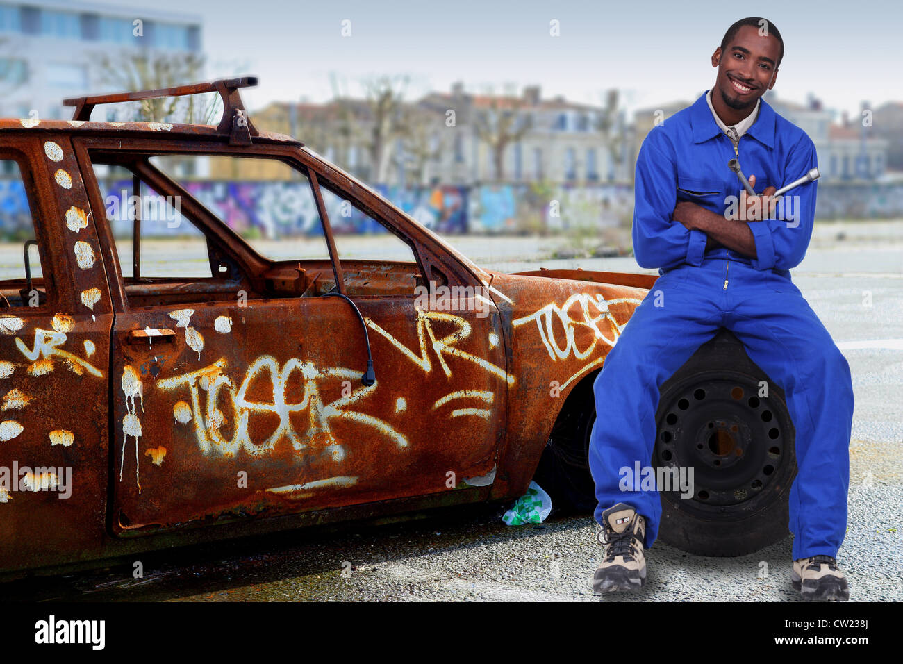 Urban mechanic with a graffitied car Stock Photo - Alamy