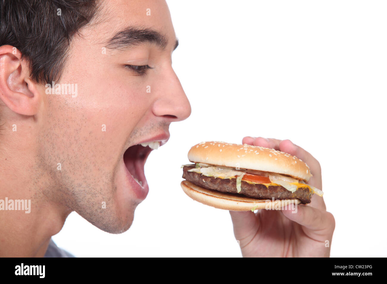 man eating hamburger Stock Photo - Alamy