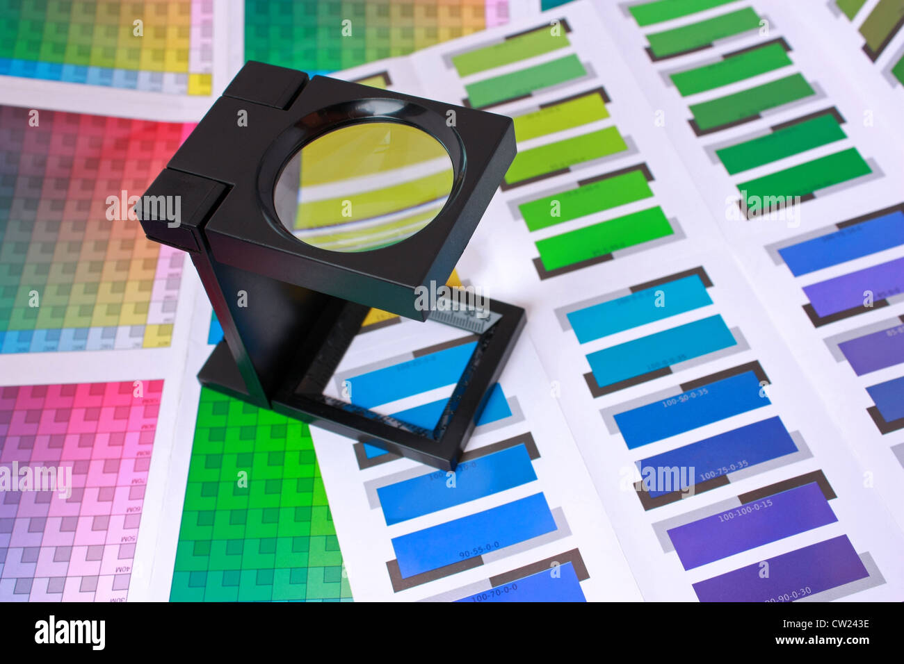 Magnifying Glass on Color Swatches Series Stock Photo - Alamy