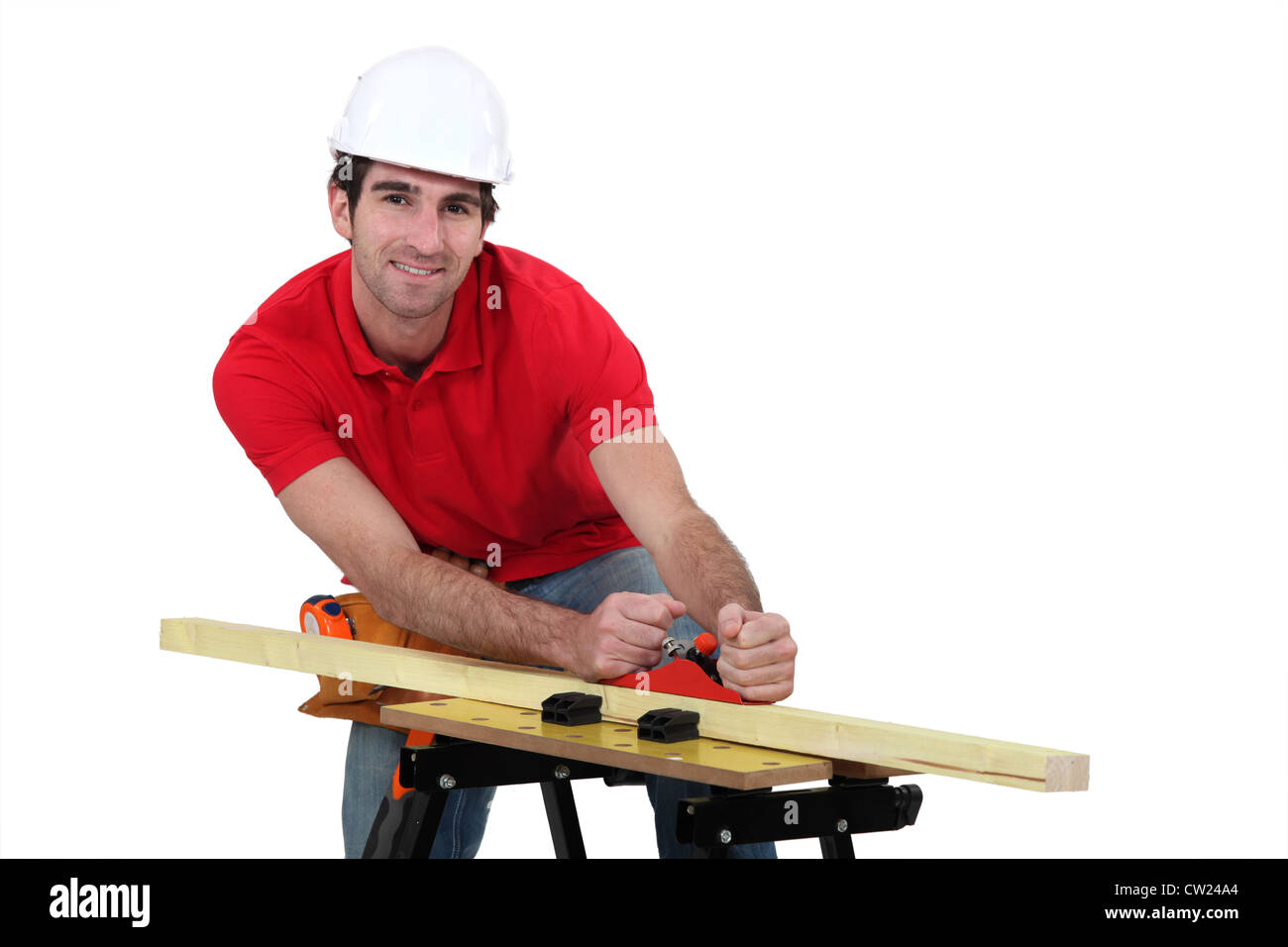 Man planing wood Stock Photo - Alamy