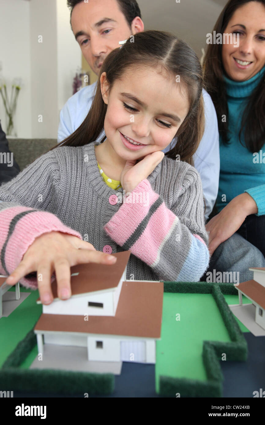 Young family with model housing Stock Photo - Alamy