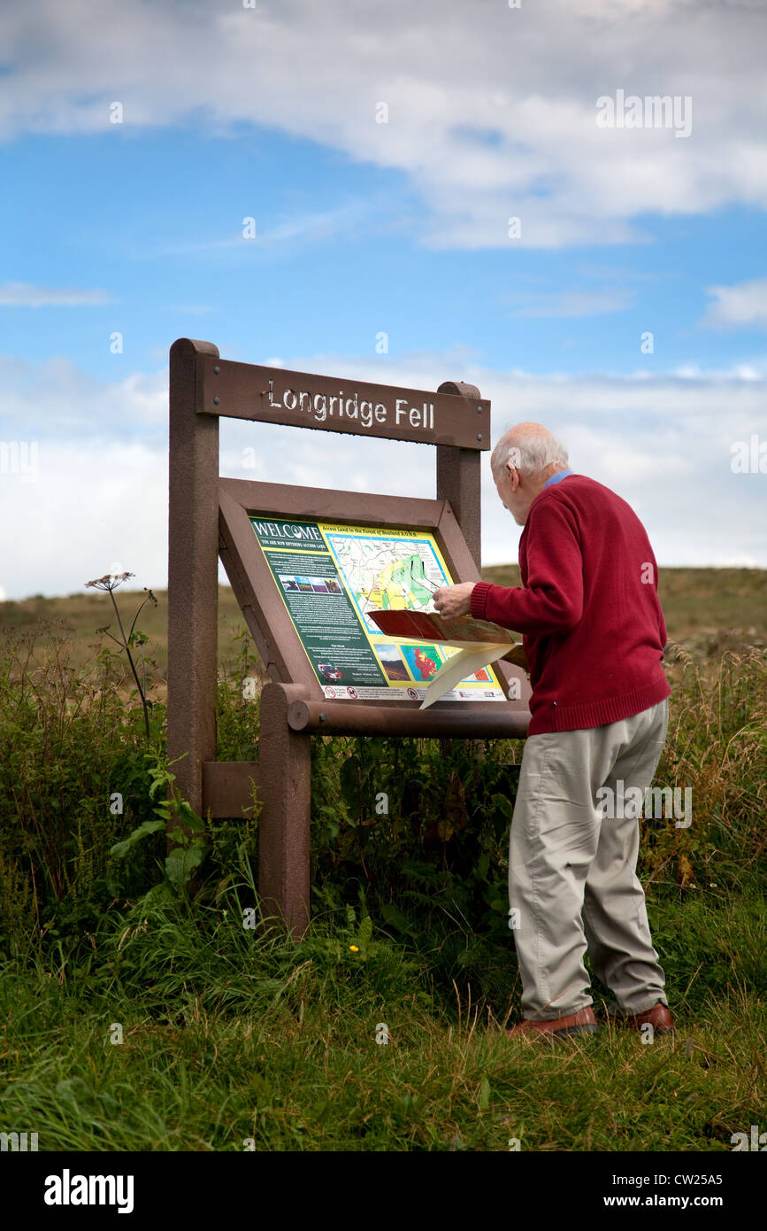 Elderly pensioner, senior at information Point and Maps at Longridge ...