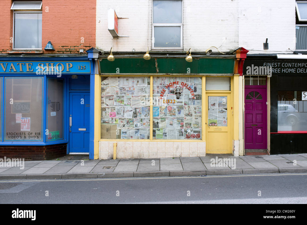 Chinese takeaway closed down with sheets of newspaper obscuring the ...