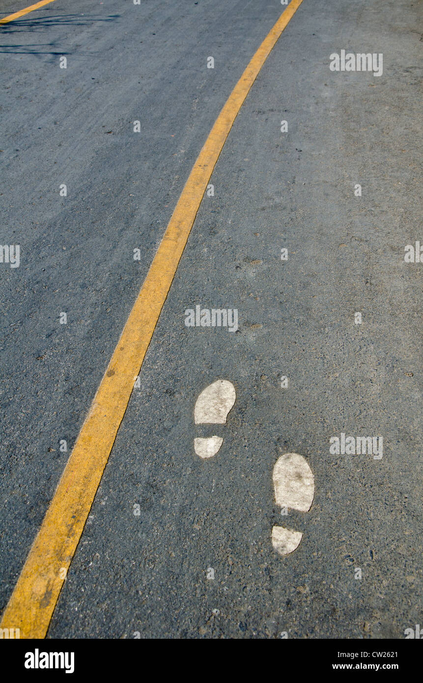 footmarks on walking track Stock Photo - Alamy